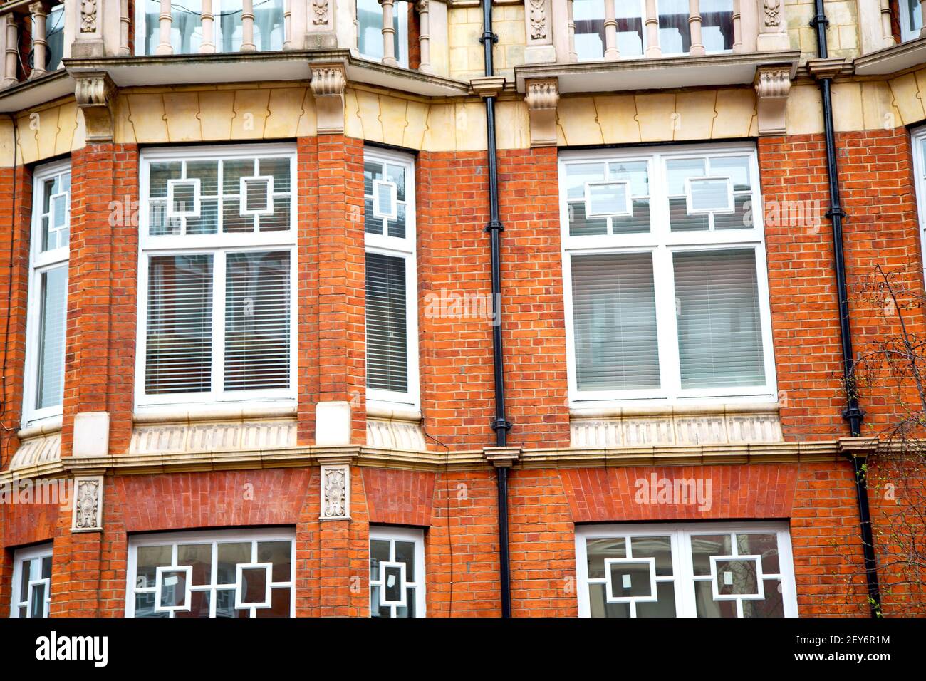 Window in europe london red brick l and Stock Photo - Alamy