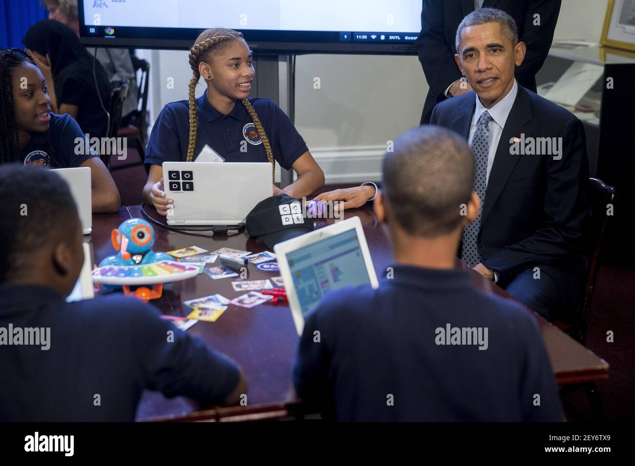 U.S. President Barack Obama, right, talks to middle-school students who ...