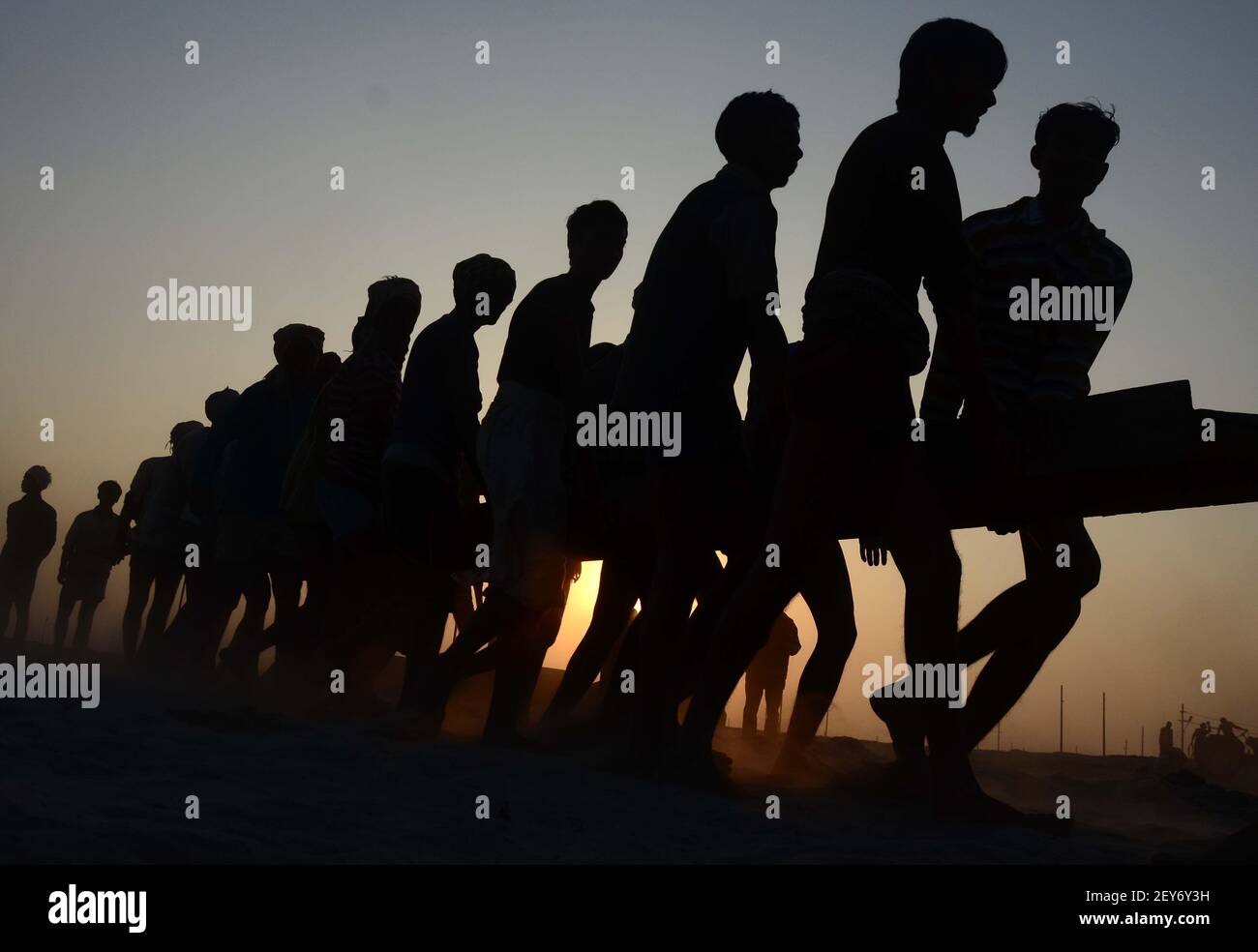 ALLAHABAD, INDIA - DECEMBER 9, 2014 - Worker carrying iron guarder to ...