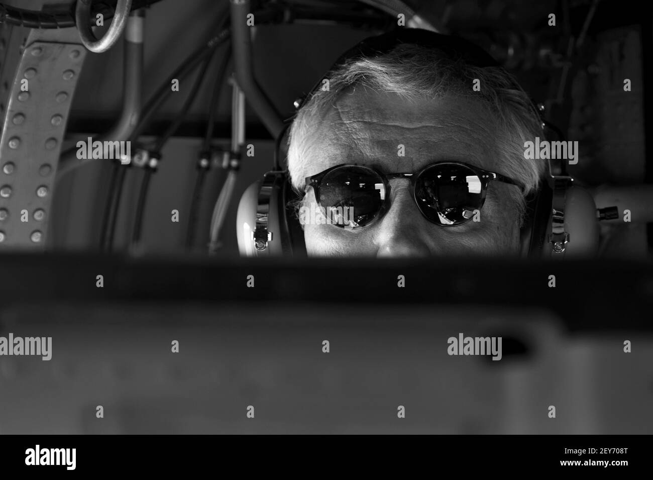 Secretary of Defense Chuck Hagel views a computer screen on board a UH ...