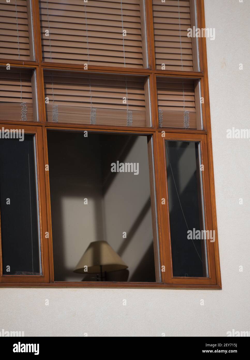 brown window blinds or shades blocking light coming through exterior ...