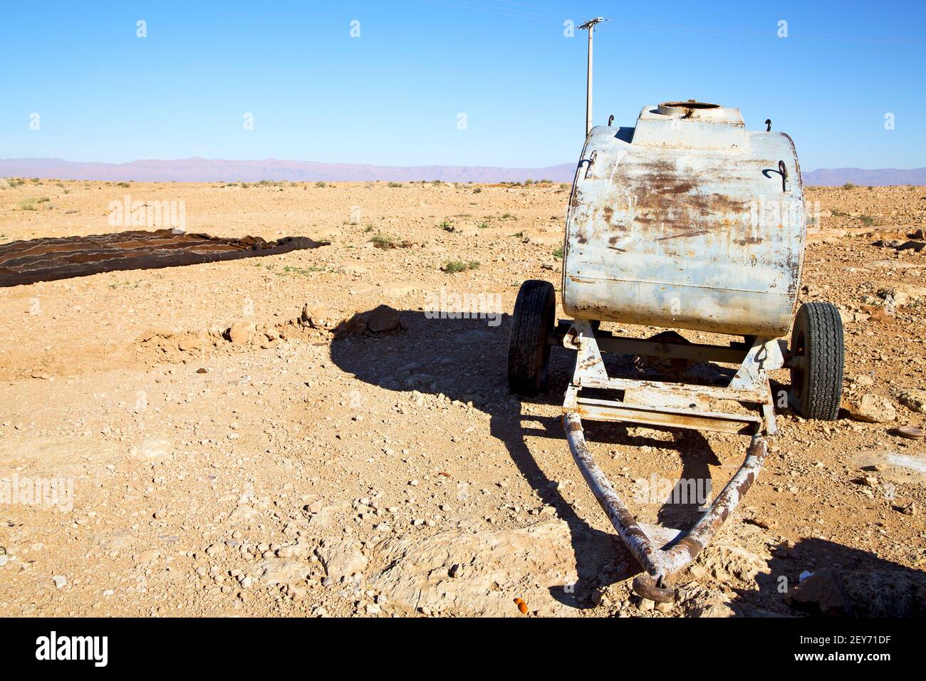 Water tank in morocco utility pole and arid Stock Photo - Alamy