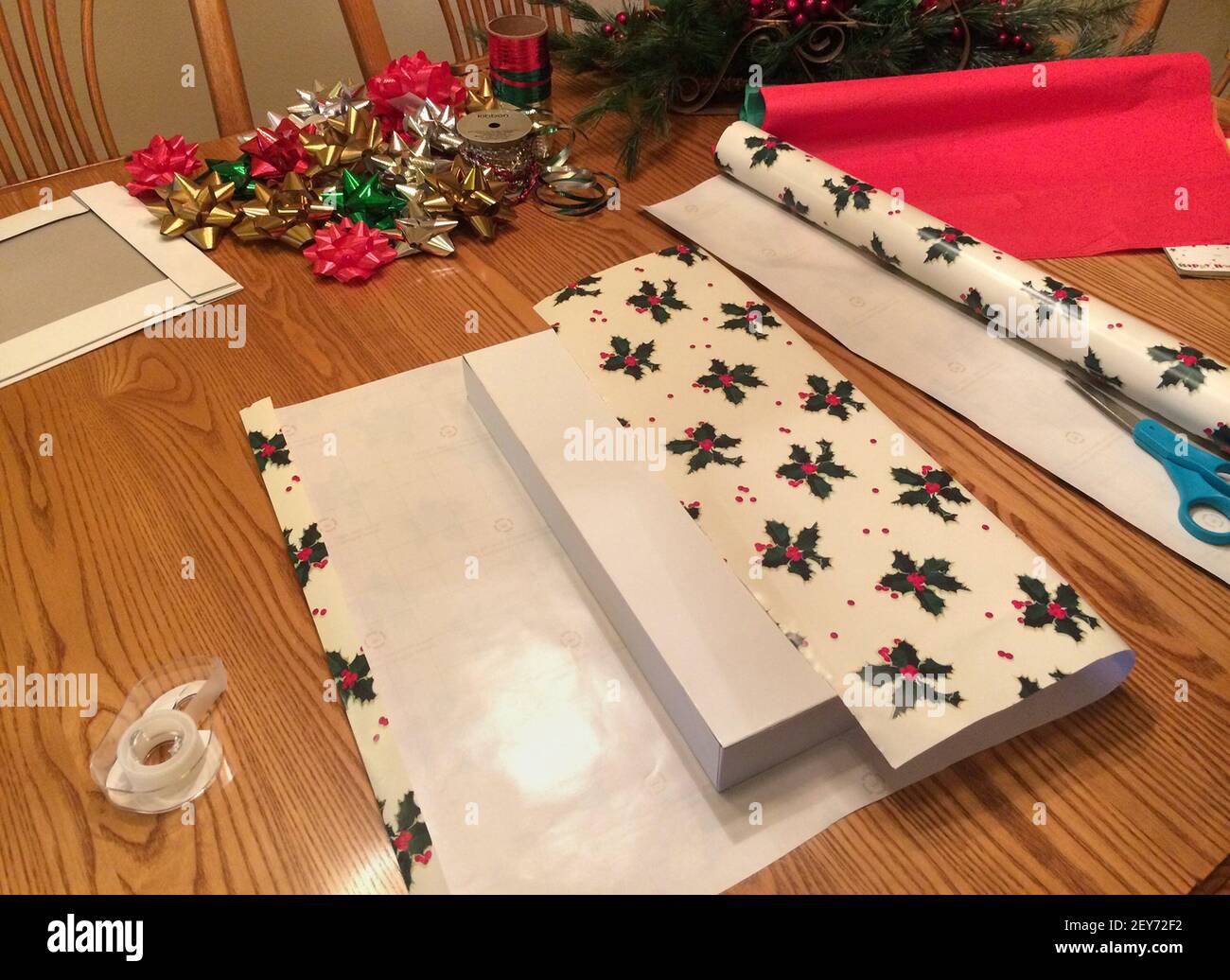 After taping down one side of the wrap, make a fold along the other for ...