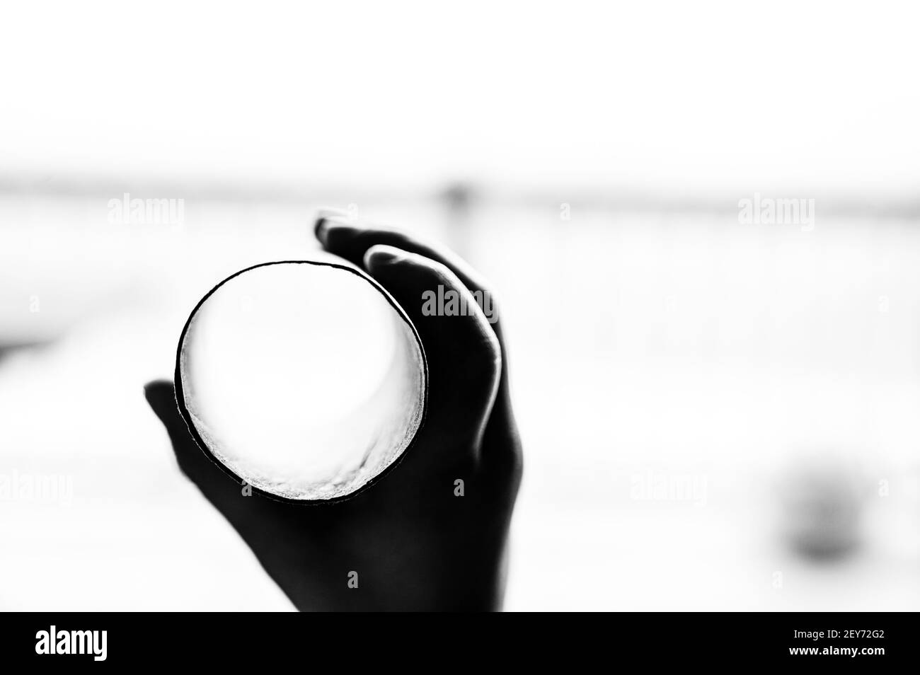 Child using imagingation to play with a cardboard tube as a telescope ...