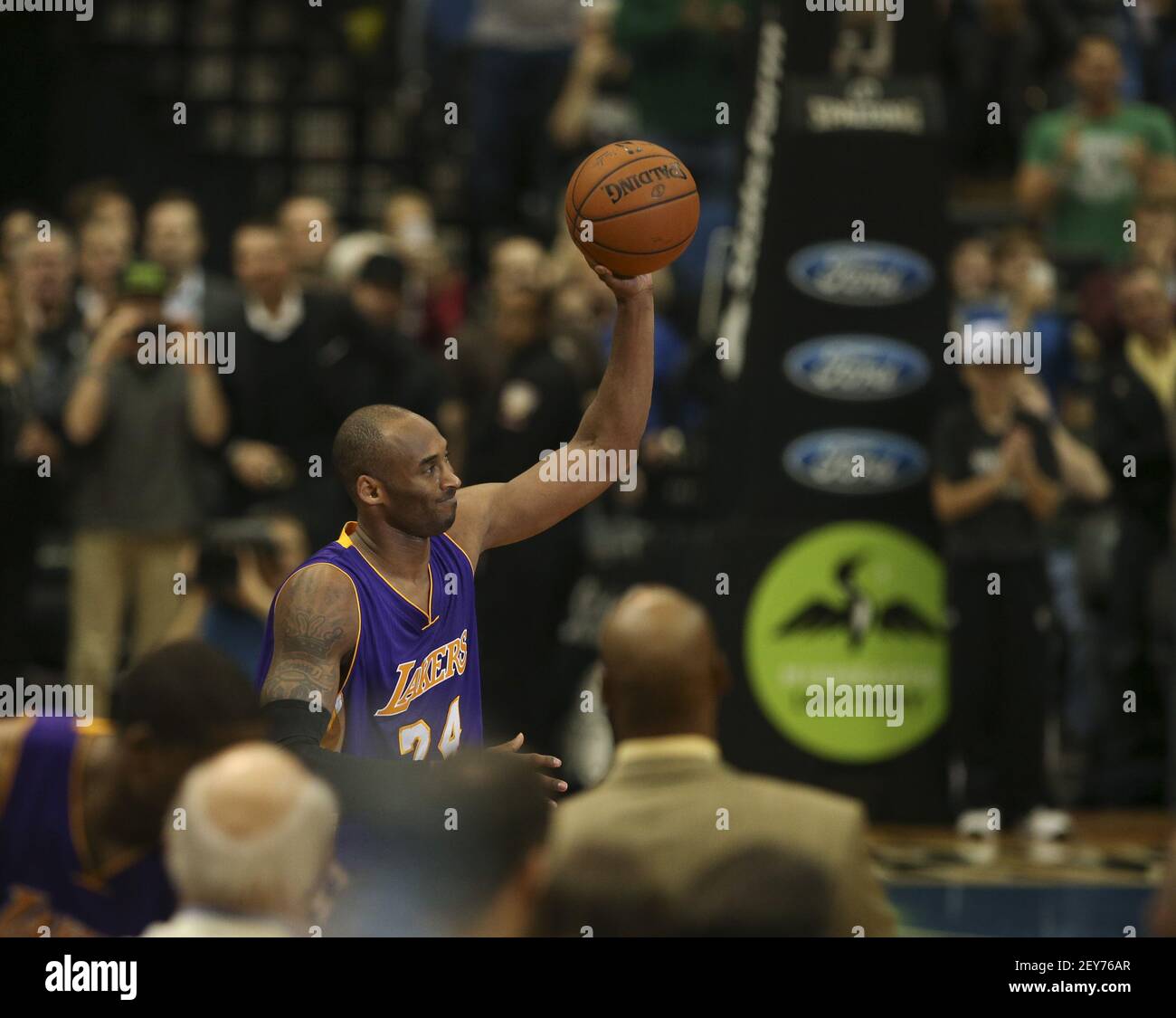 Kobe Bryant acknowledges the crowd after he was presented with the game ...