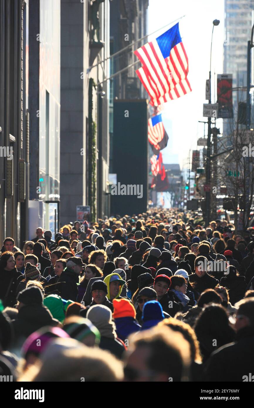 A crowd of people walks on the Fifth Avenue during the Winter Holiday ...