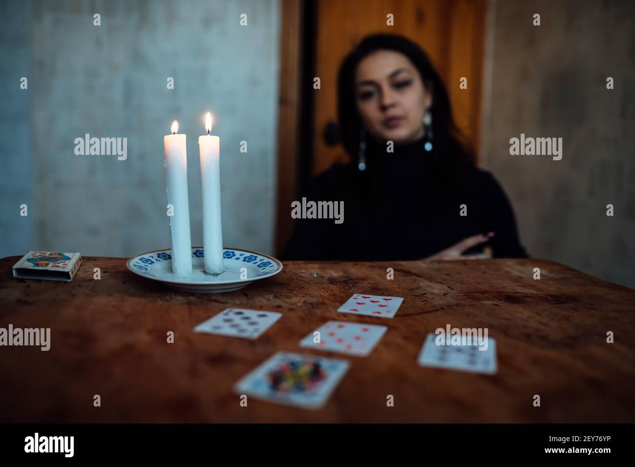 a fortune teller lights ritual candles to predict the future using ...