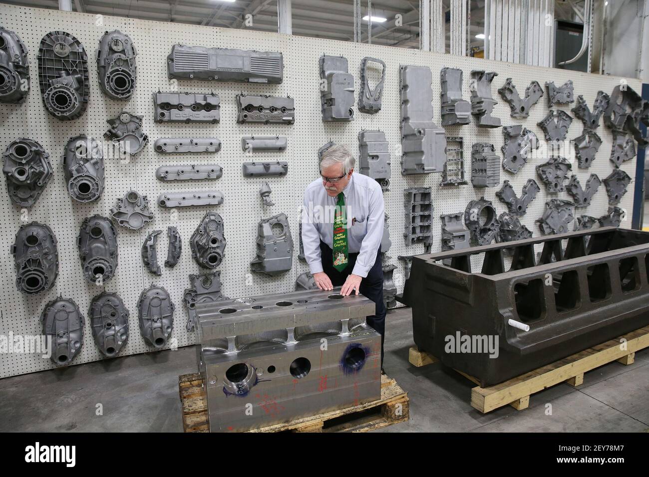Michael Retzer, controller at Strohwig Industries, looks over a pump ...