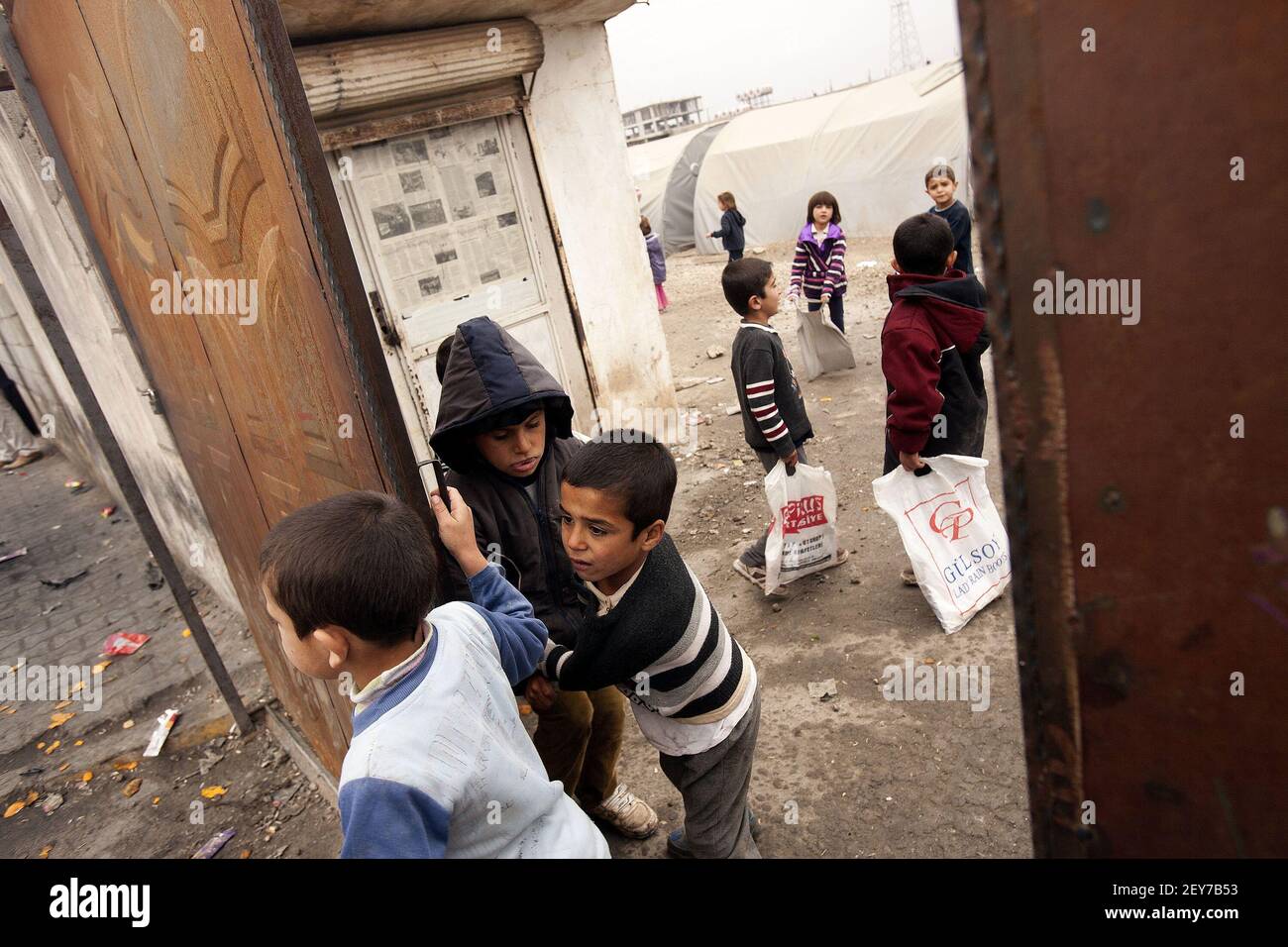 Kurdish children play at the entrance of a camp in Urfa, Turkey, where ...