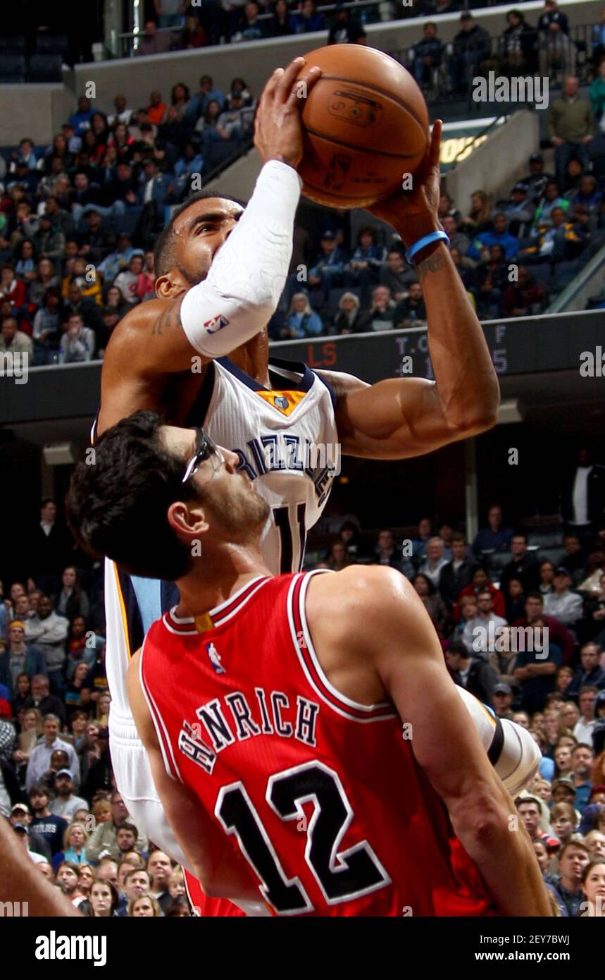 The Memphis Grizzlies' Mike Conley shoots while defended by the Chicago ...