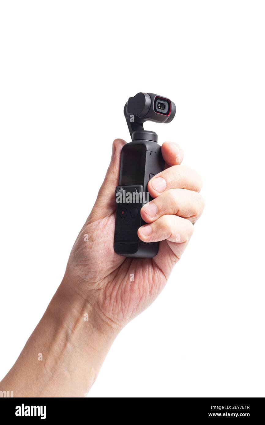 Hand hold action camera isolated on white background Stock Photo - Alamy