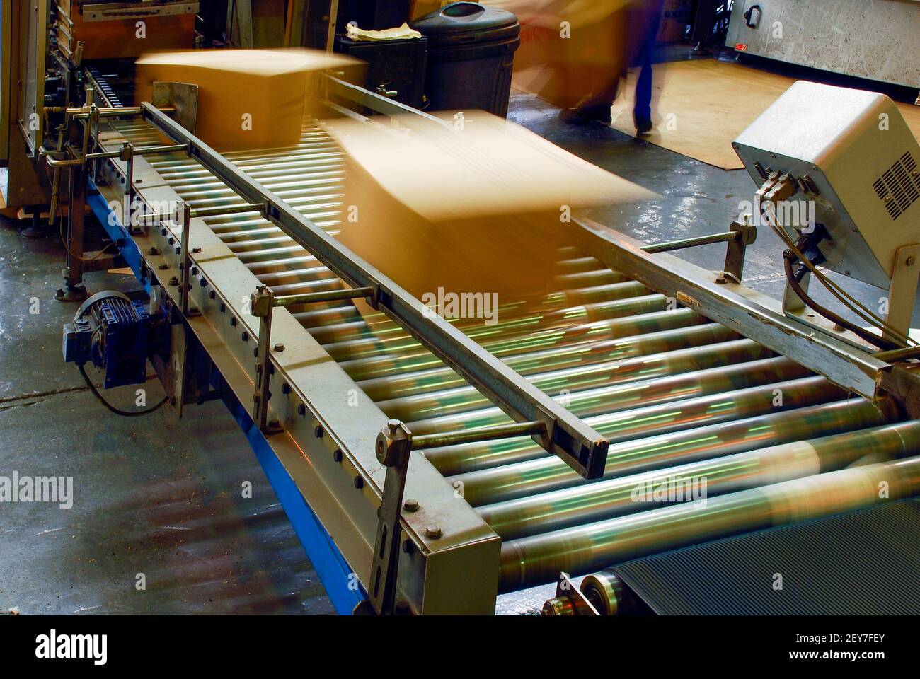 Box packing machine with conveyor, engine oil filling factory Stock ...