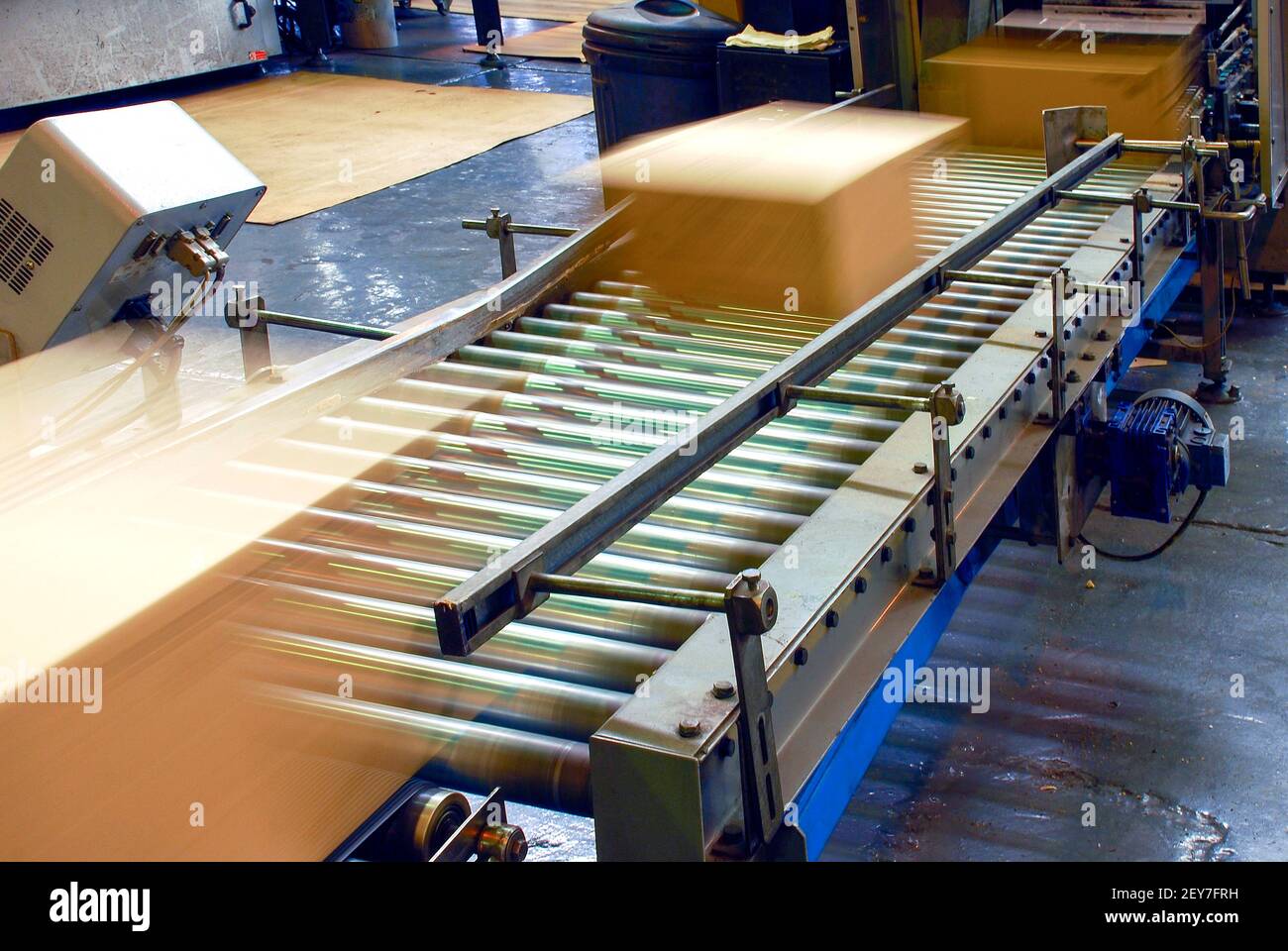 Box packing machine with conveyor, engine oil filling factory Stock ...