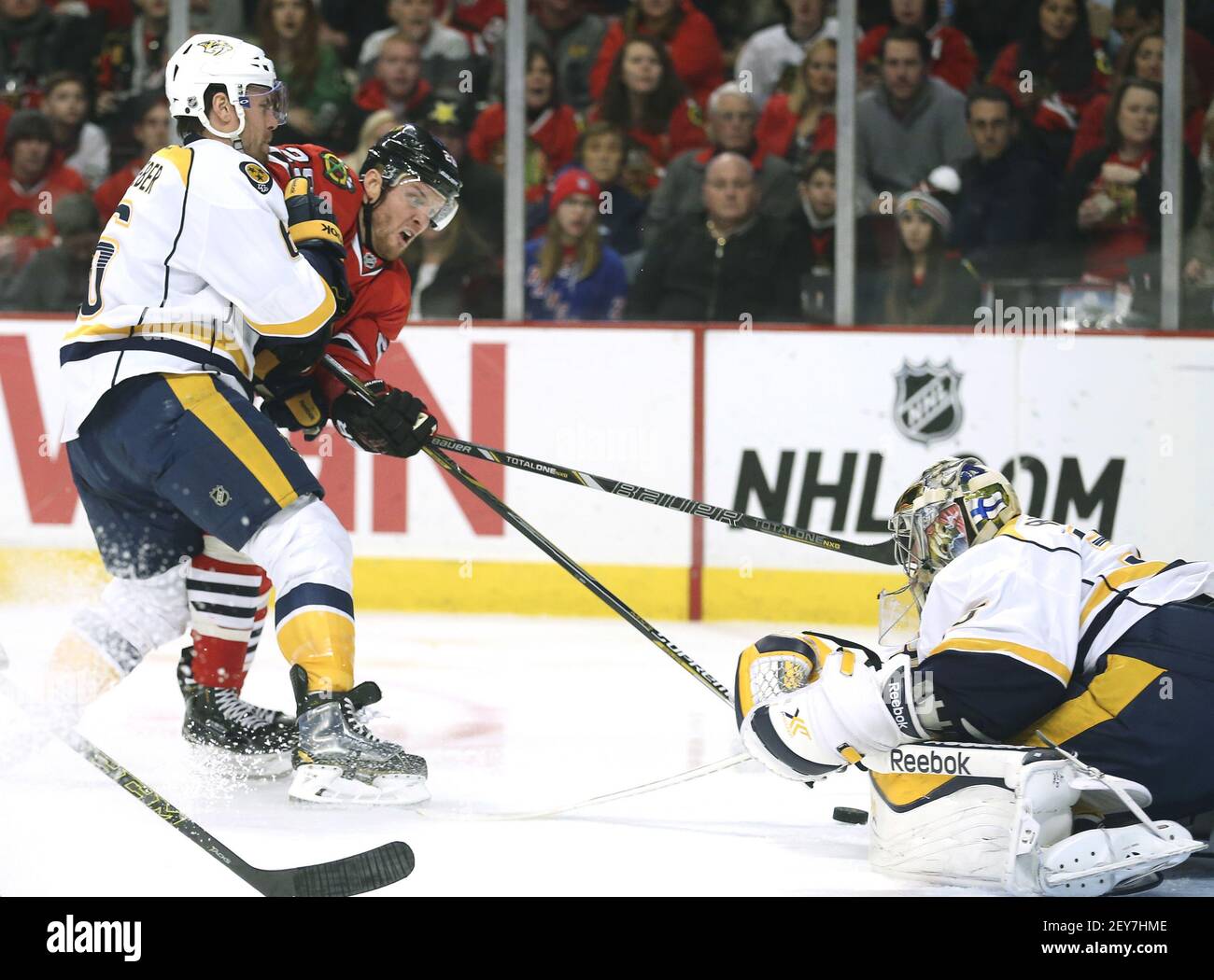 The Chicago Blackhawks' Bryan Bickell (29) gets a shot while being ...