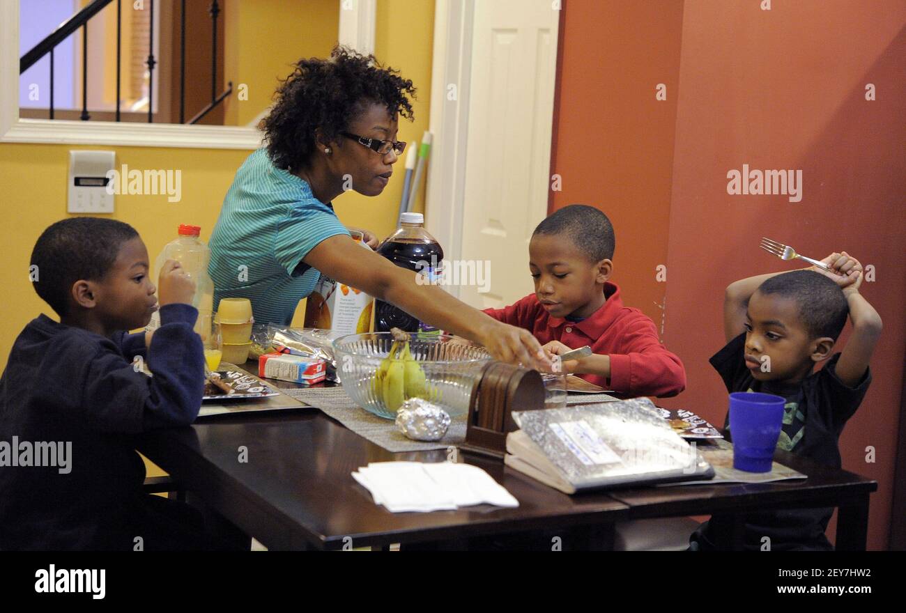 Nichole Parrish makes breakfast for her three half brothers: Isaac, 6 ...