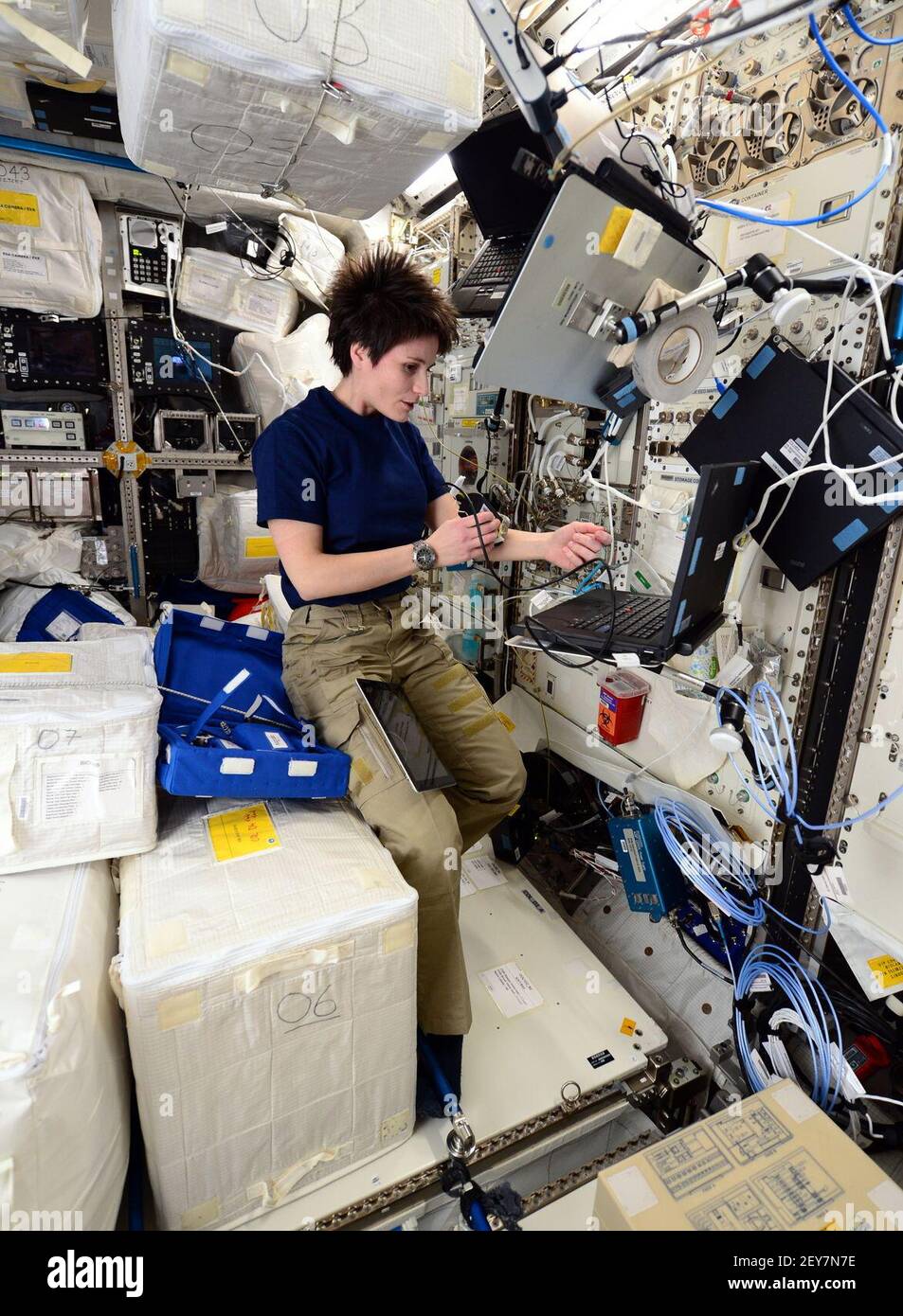 ESA astronaut Samantha Cristoforetti running the Skin-B experiment on ...