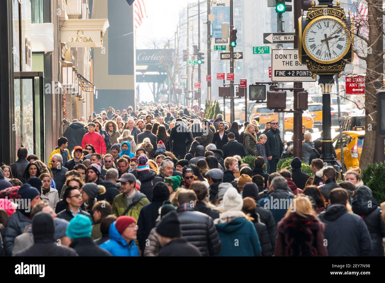 A crowd of people walks on the Fifth Avenue during the Winter Holiday ...
