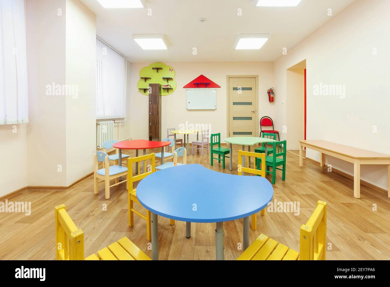 Colorful tables for classes for children and light beige colored game ...