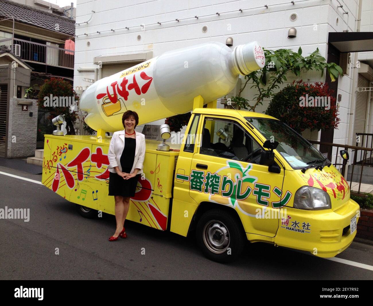 Hideko Tanaka, president of Hakusui-Sha, stands in front of the Hi-Sour mobile, her company's ...