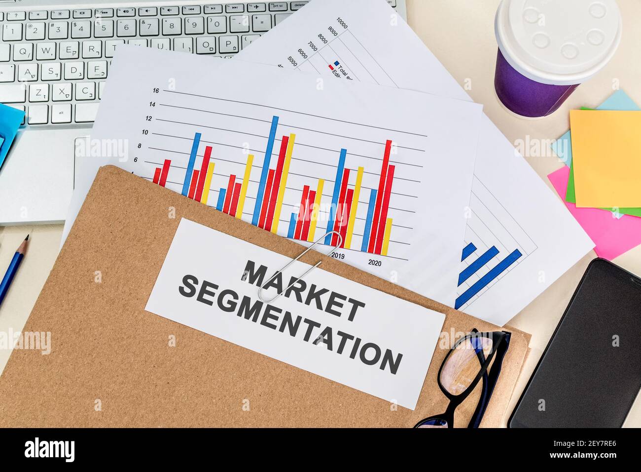 A top view of a folder labelled "MARKET SEGMENTATION" on a laptop with ...