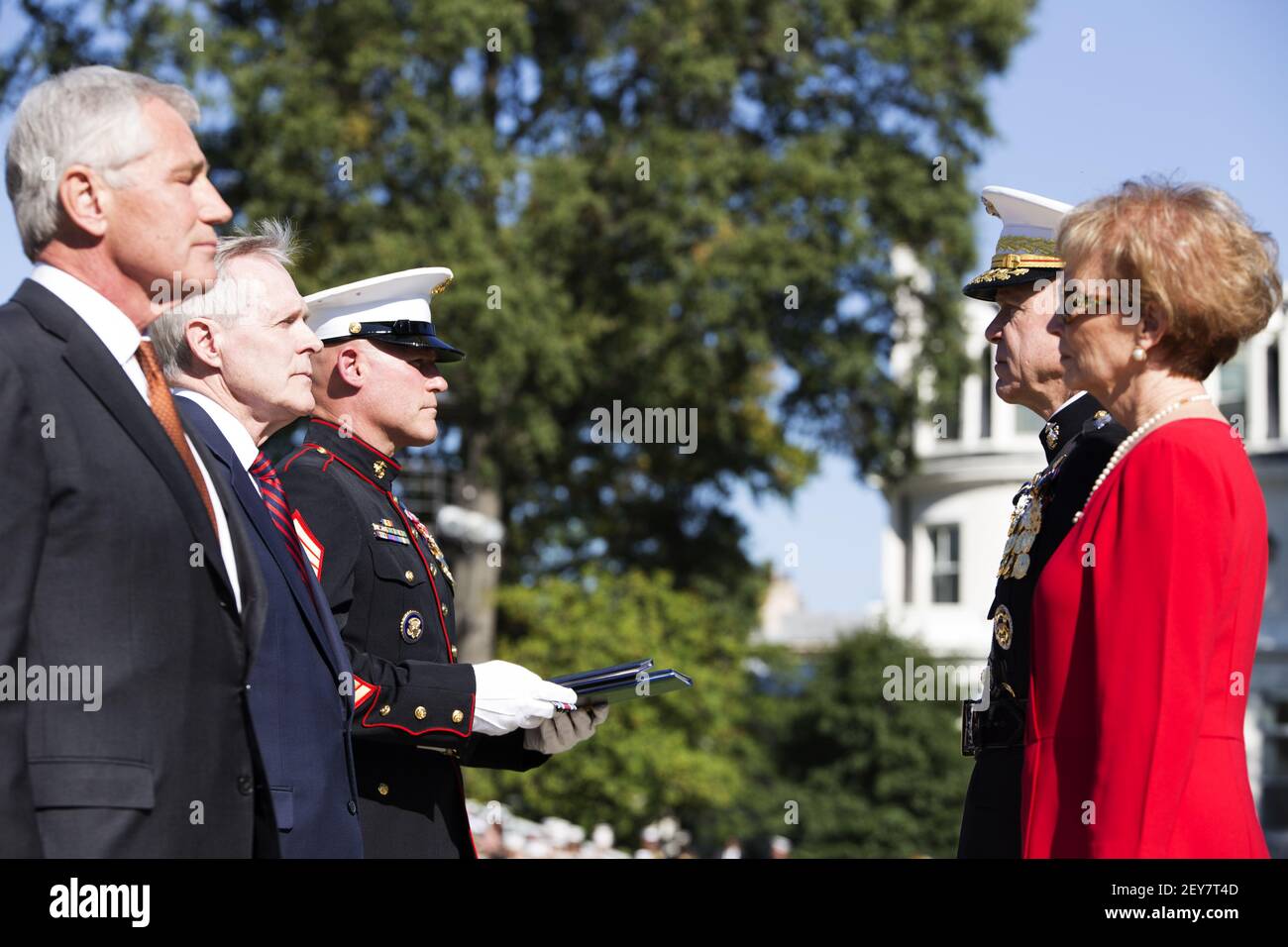 Secretary of Defense Chuck Hagel, left foreground, stands with ...