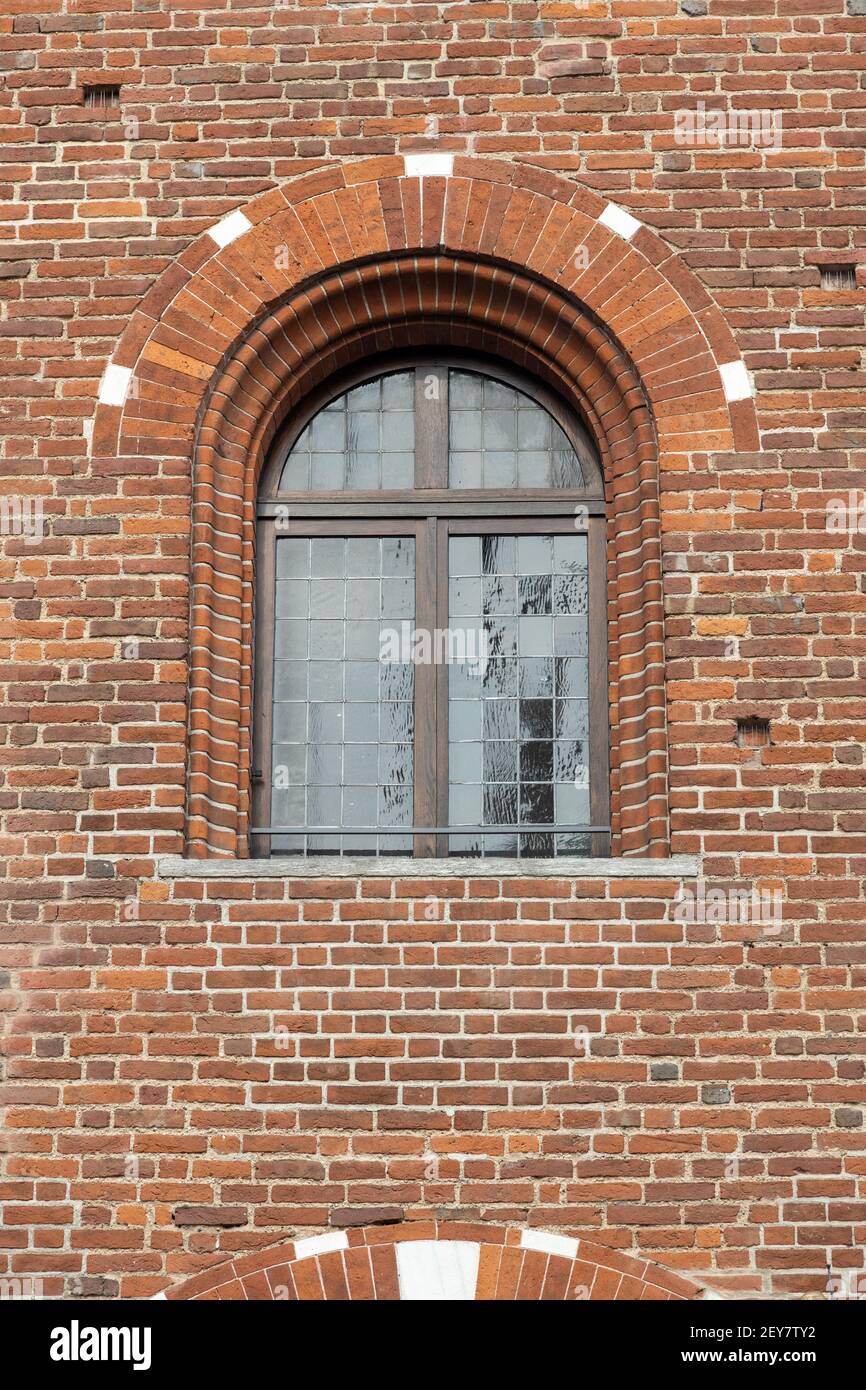 ancient medieval arched window , red bricks wall Monza, Italy Europe ...