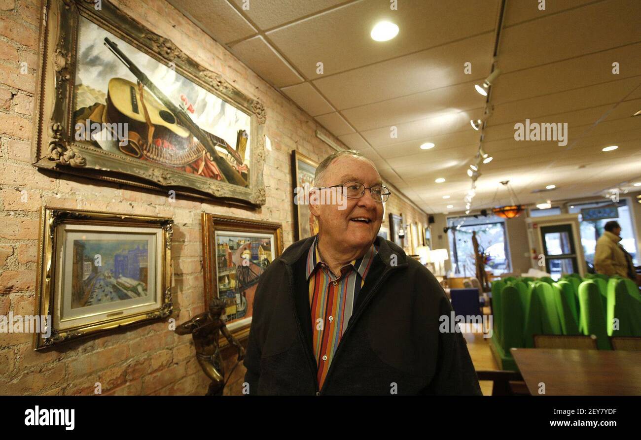 Former Illinois Gov. James Thompson looks over several of pieces of his ...