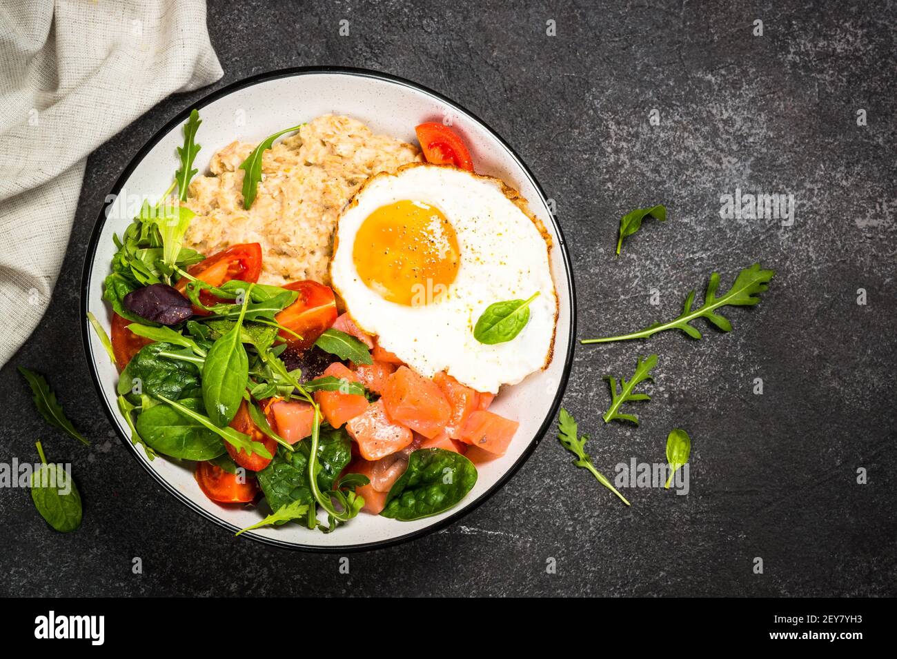 Savory breakfast with oatmeal, salmon and salad Stock Photo - Alamy