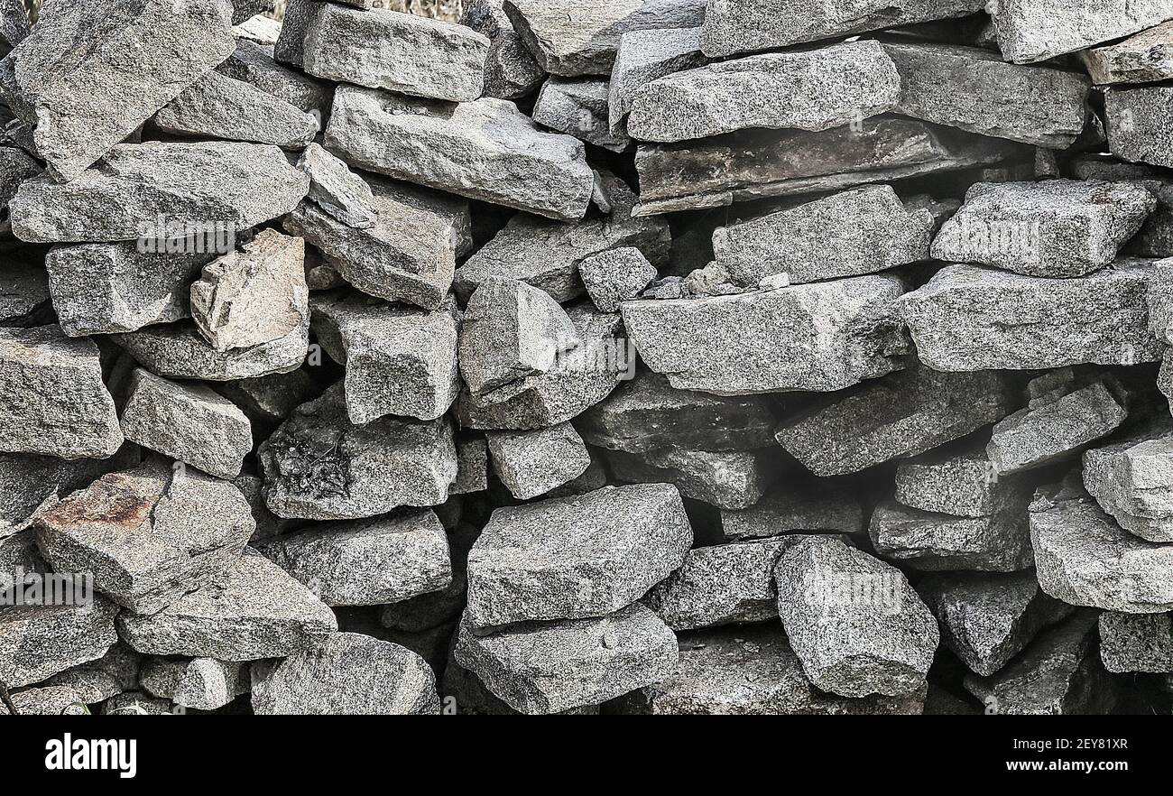 old rough stone wall background Stock Photo - Alamy