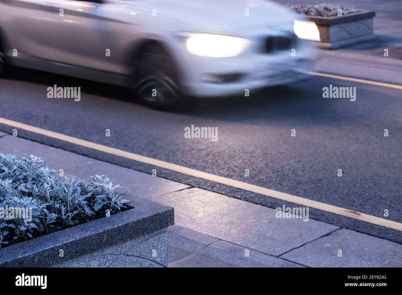 car is moving fast on the city street Stock Photo - Alamy