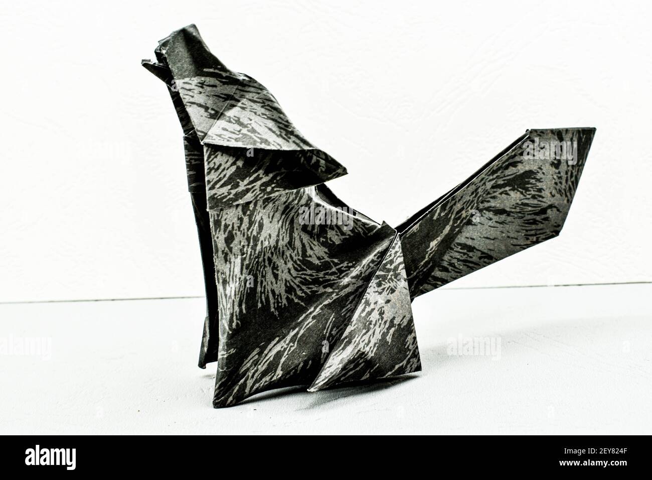 Wolf made out of gray folded paper. Satisfying origami Stock Photo - Alamy