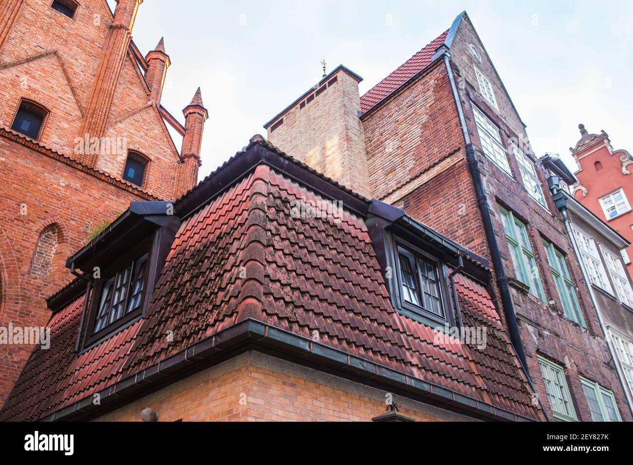 brick walls and tiled roofs of ancient European buildings Stock Photo ...