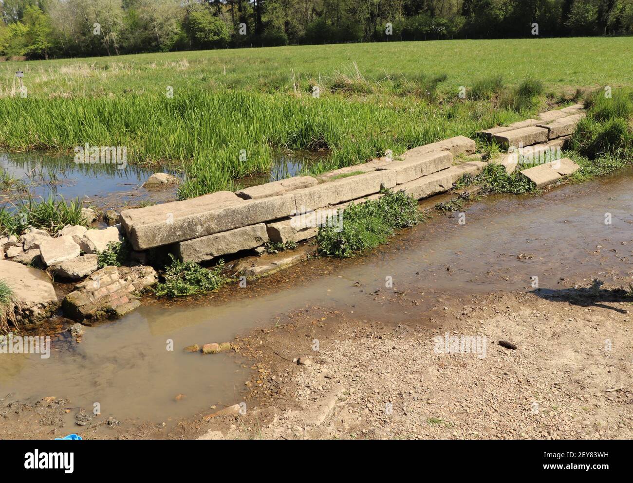Ground level close up of mud and water sloshing down a stream Stock ...