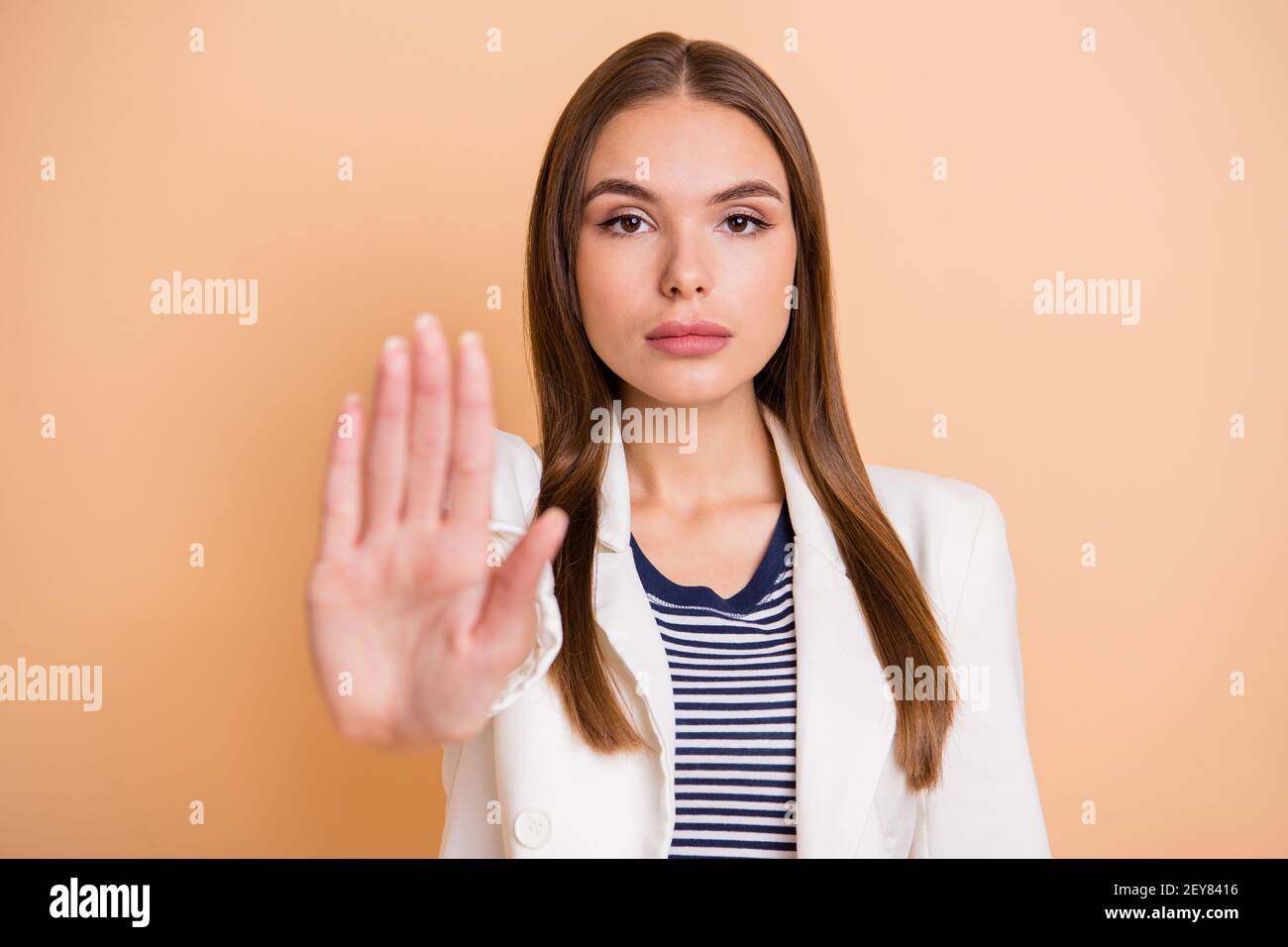 Photo of confident cool girl palm showing ban sign look camera wear ...