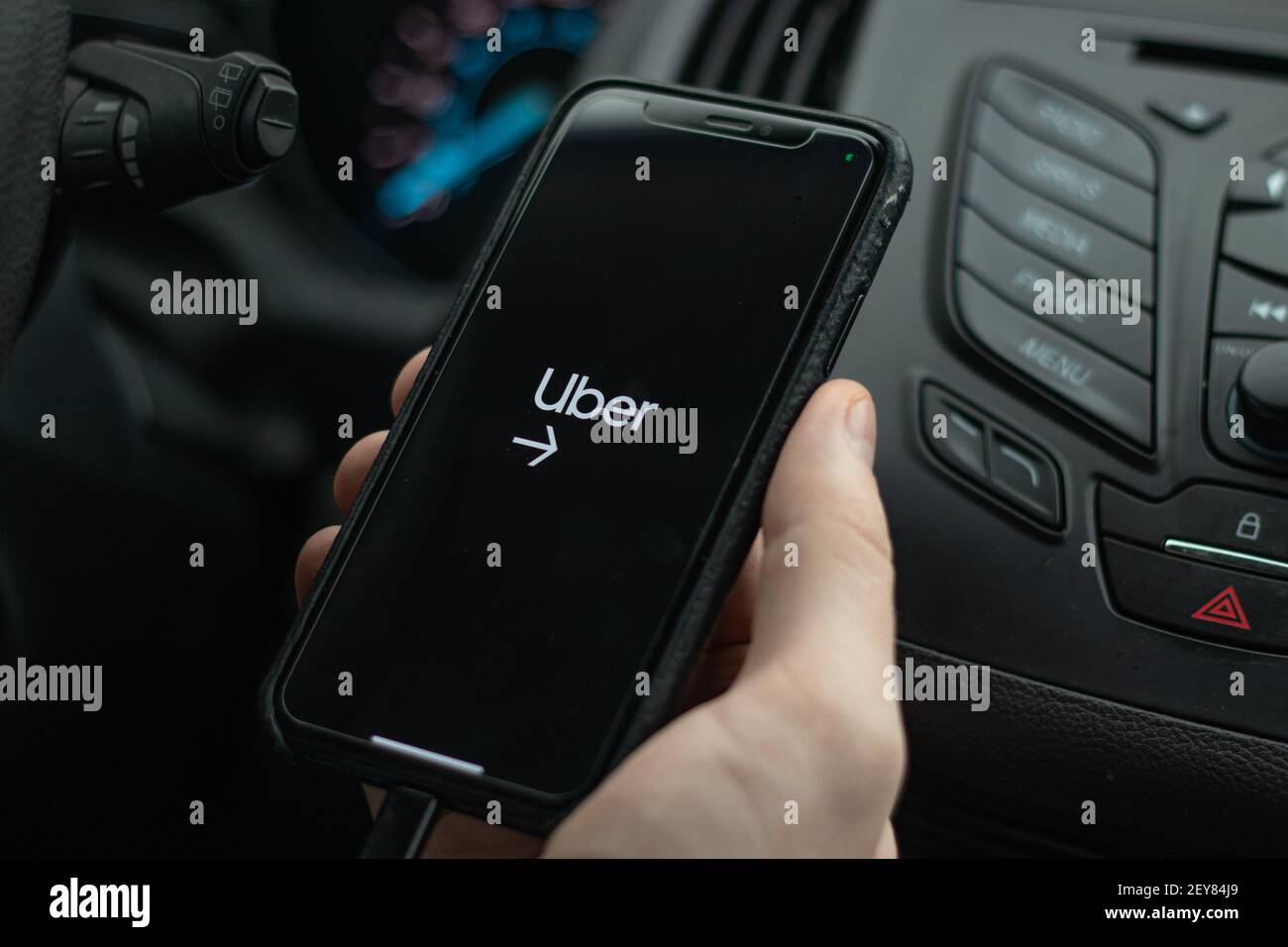 Vancouver, Canada - February 27, 2020: A person is holding the phone ...