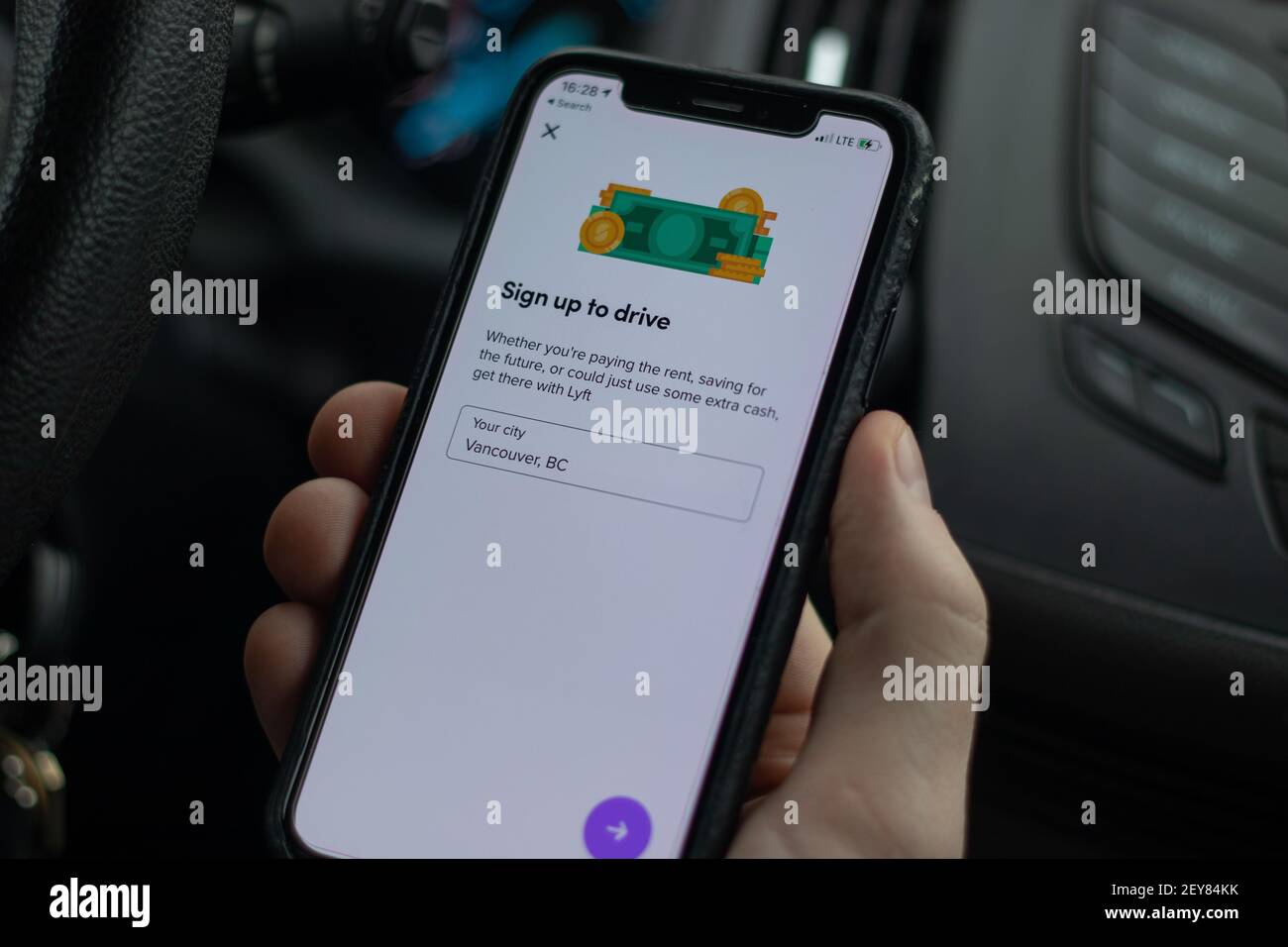 Vancouver, Canada - February 27, 2020: A person is holding the phone ...