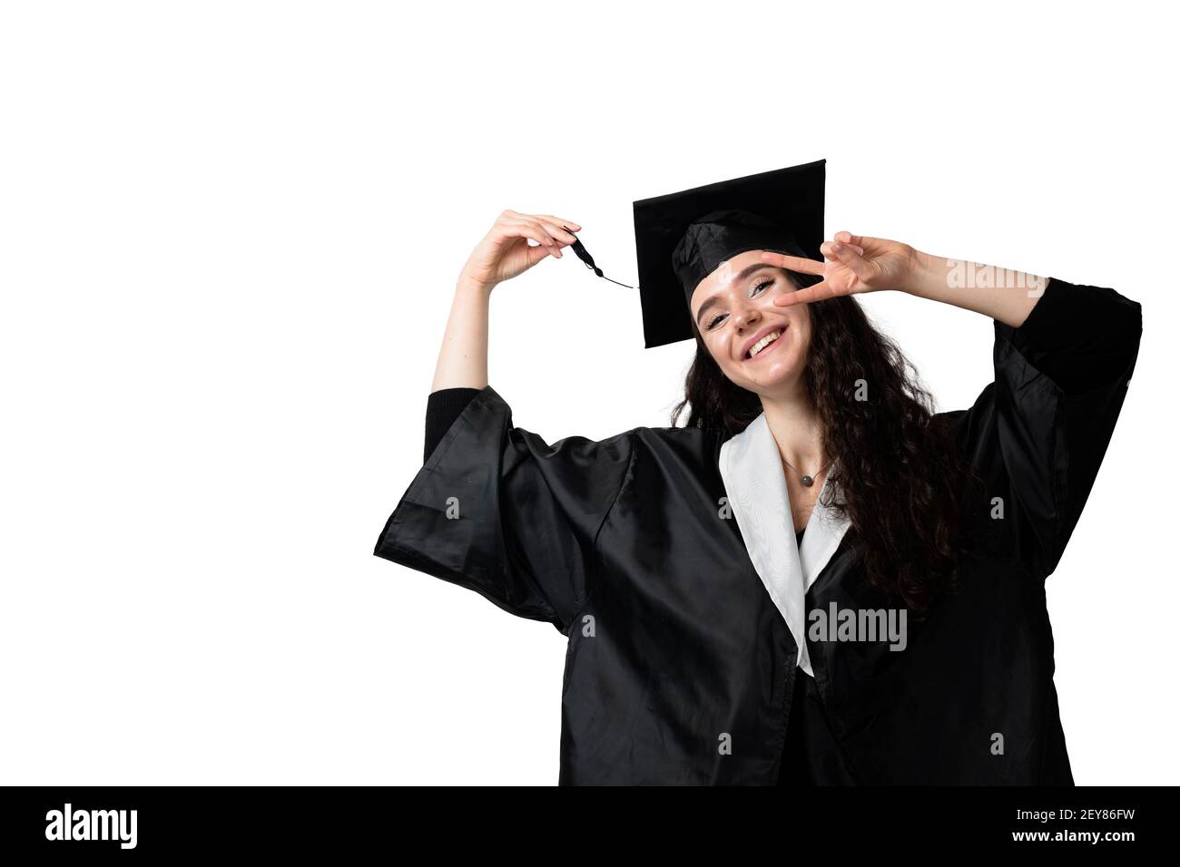 Graduate girl with master degree in black graduation gown and cap on ...