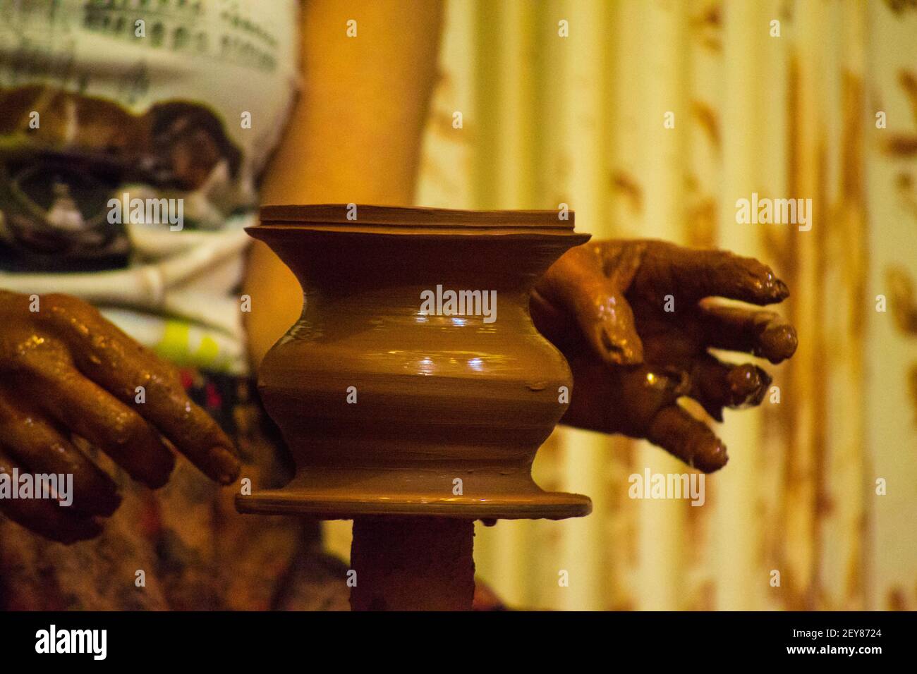 Local potter forming a clay pot with a homemade wheel in the Uchisar ...