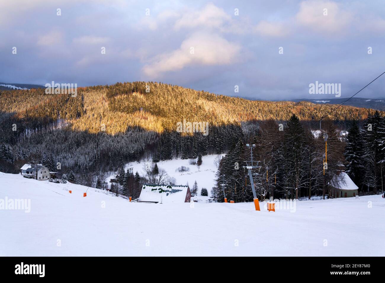 Stopped t-bar surface lift on abandoned empty ski slope, end of ski ...