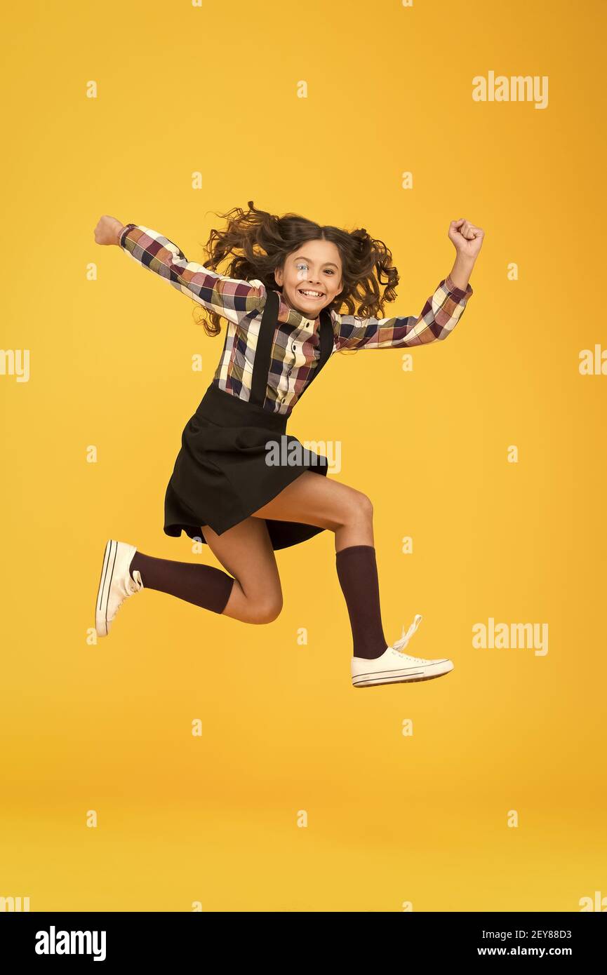 Energy and ambition. Energetic girl run to school. Happy child in ...