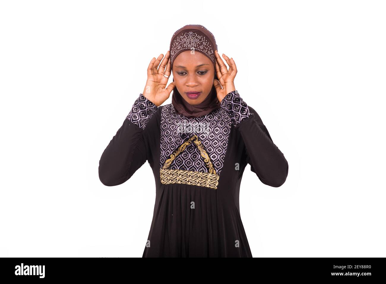 young muslim woman standing in long dress in prayer position Stock ...
