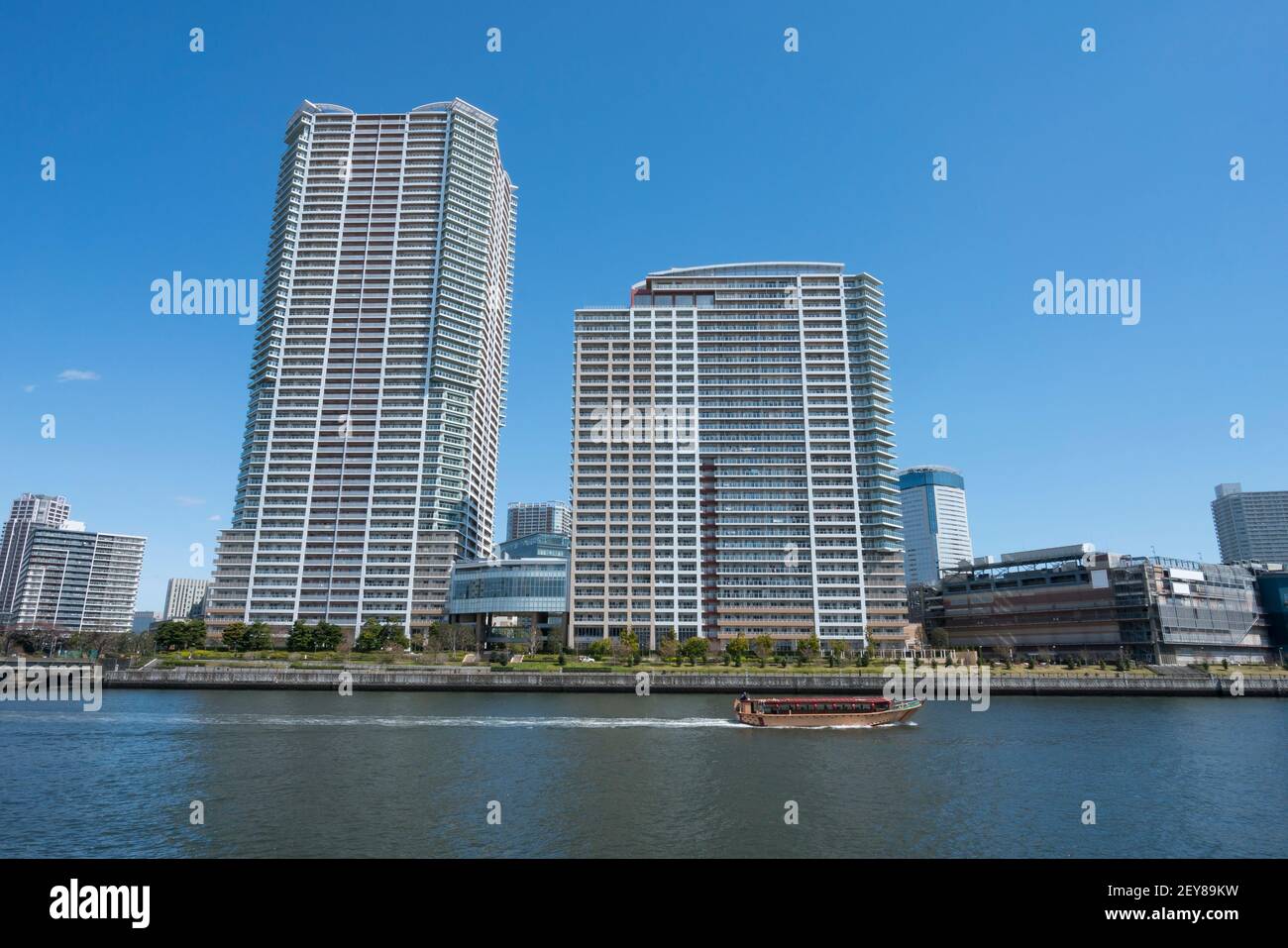 High-rise building stands in Toyosu beyond Harumi Canal Tokyo Japan ...