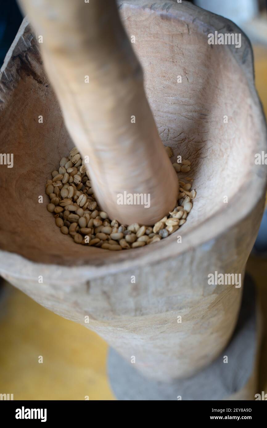 Artisanal hulling of coffee in a mortar, Filandia, Quindío, Colombia ...