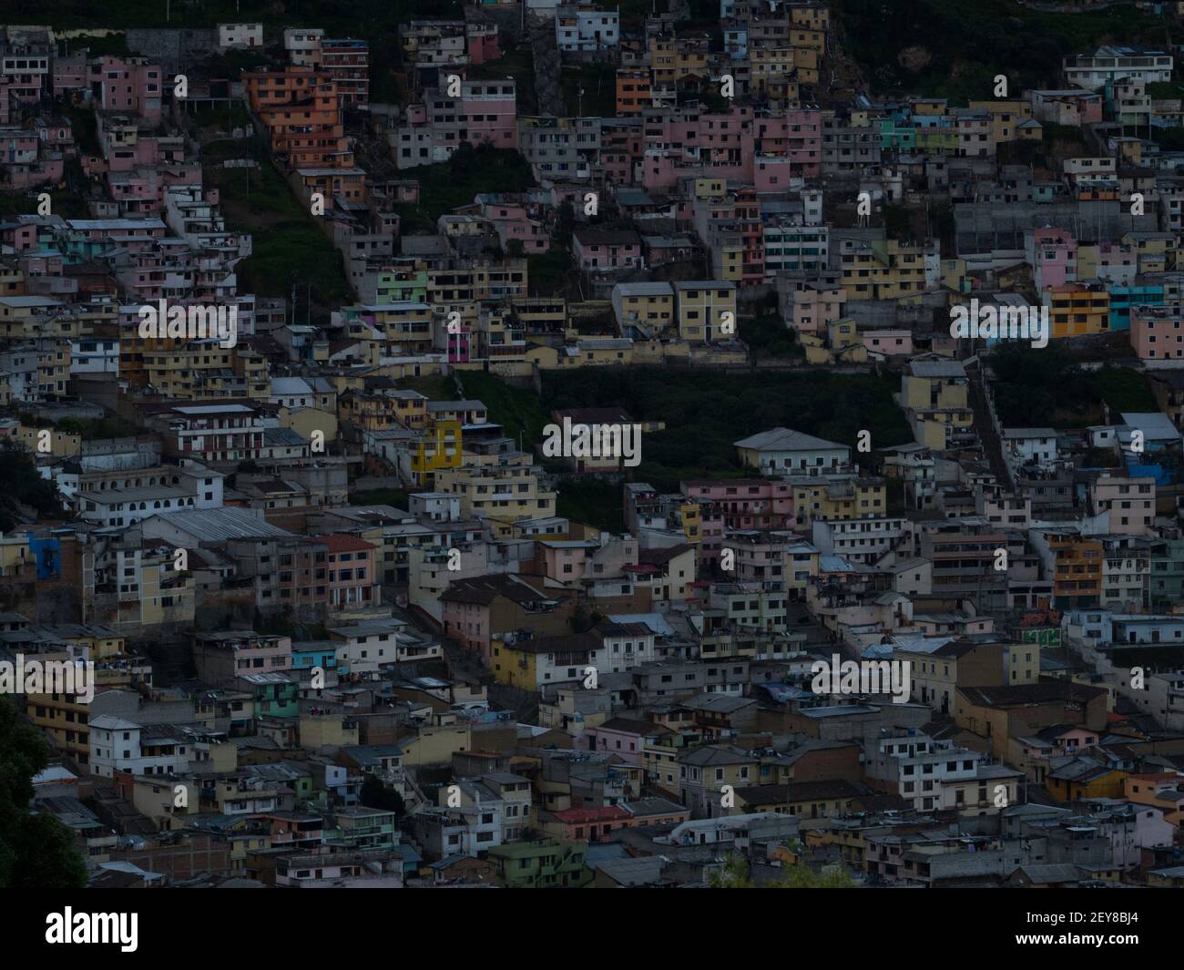 Aerial cityscape panorama of Quito skyline colorful houses buildings poverty slums from El ...