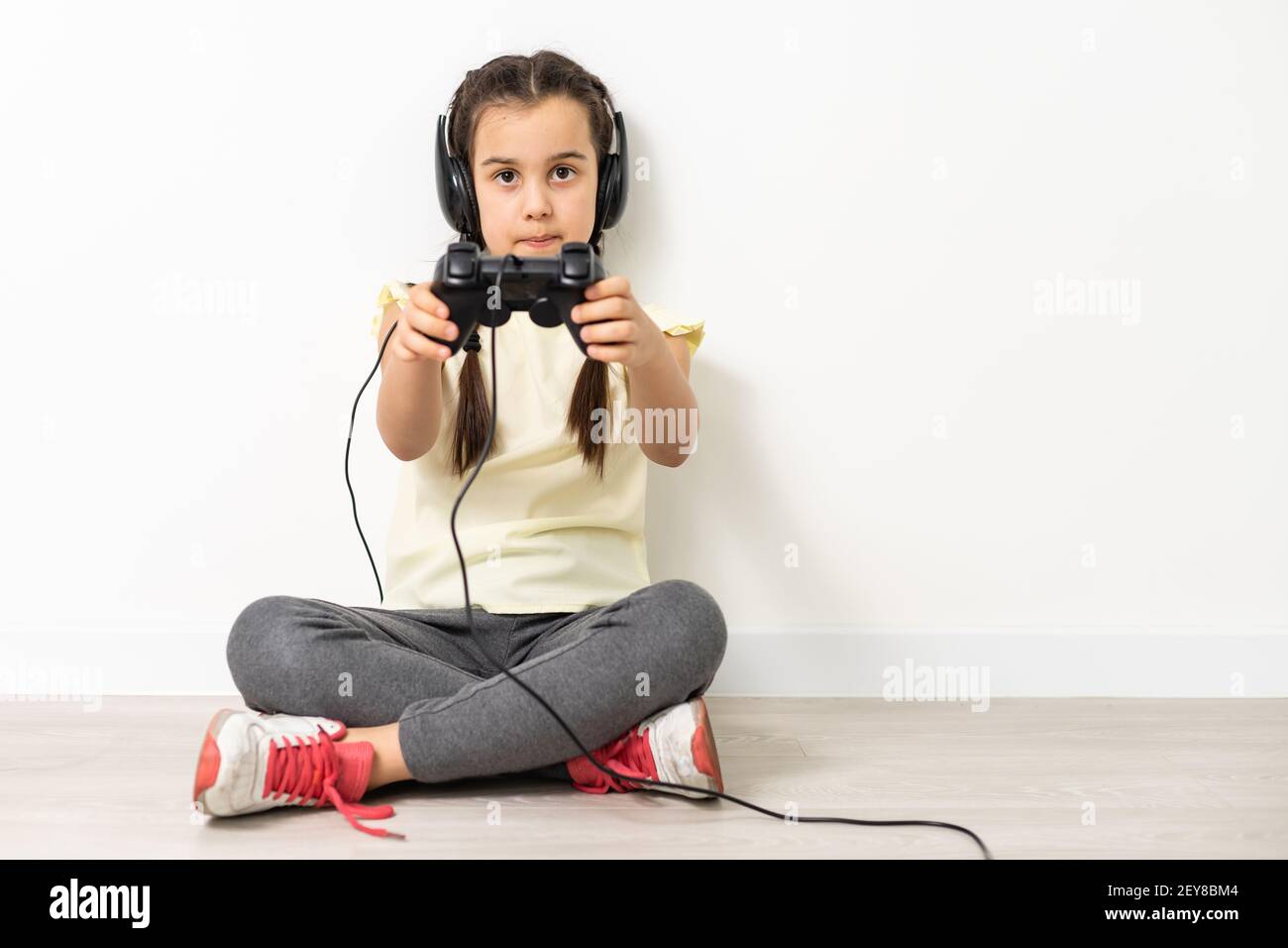 Girl using video game controller Isolated on white background Stock ...