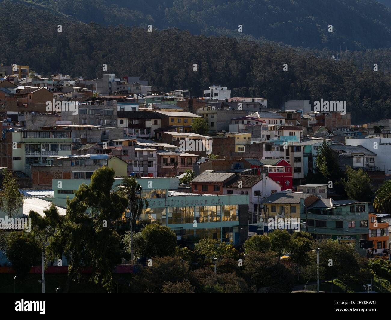 Aerial cityscape panorama of Quito skyline colorful houses buildings poverty slums from El ...
