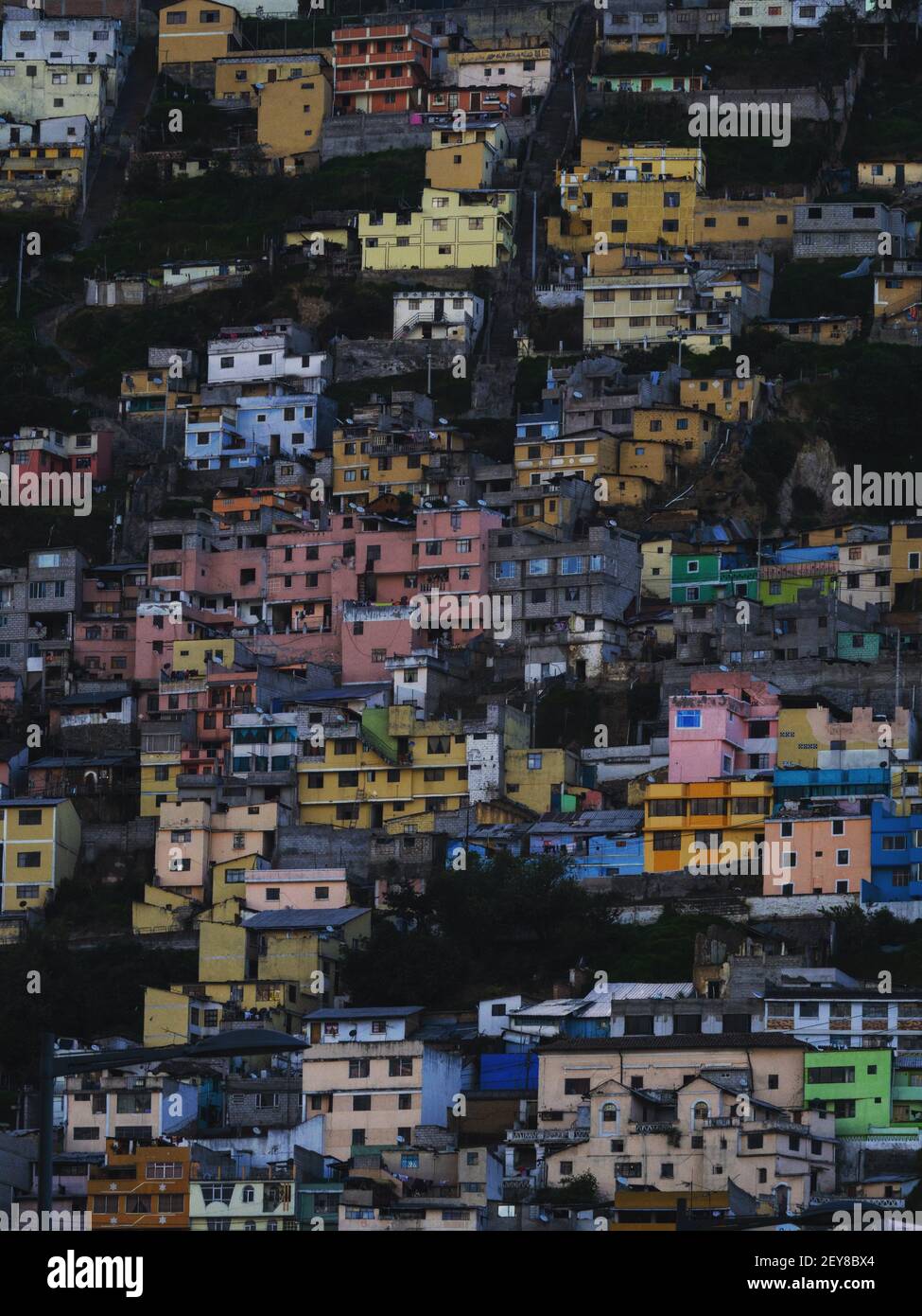 Aerial cityscape panorama of Quito skyline colorful houses buildings poverty slums from El ...