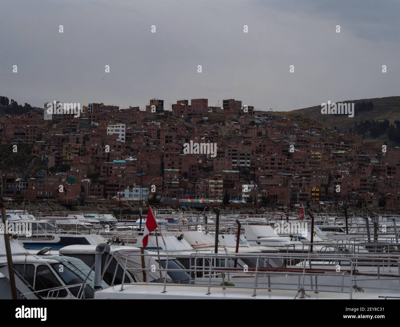 Panorama view of unfinished brick buildings houses on hill slopes of ...