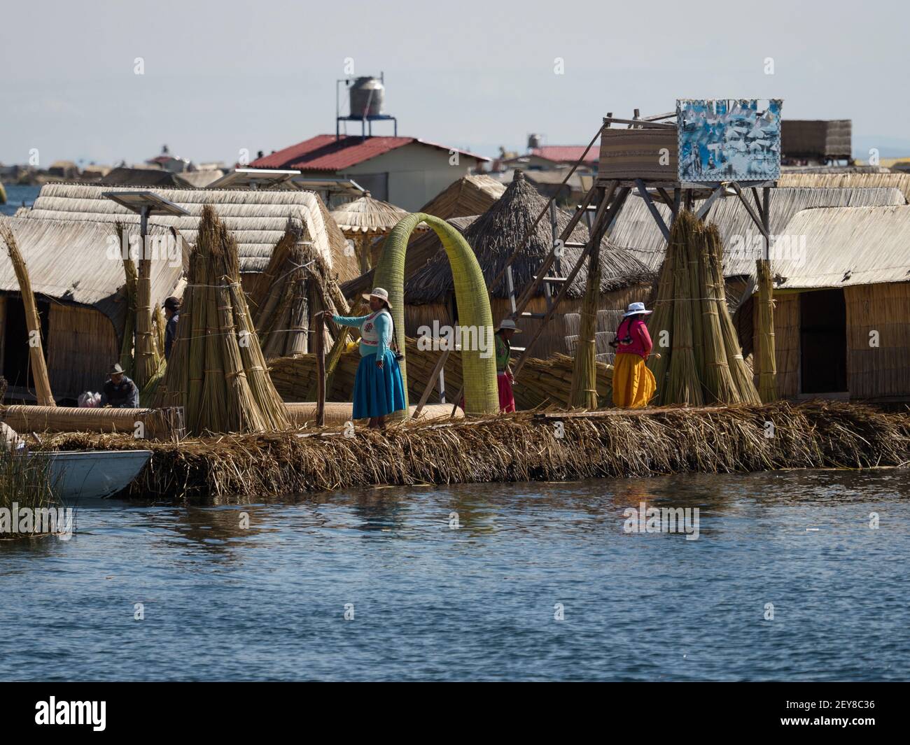 Indigenous women in colorful traditional dresses on Uros Floating reed ...