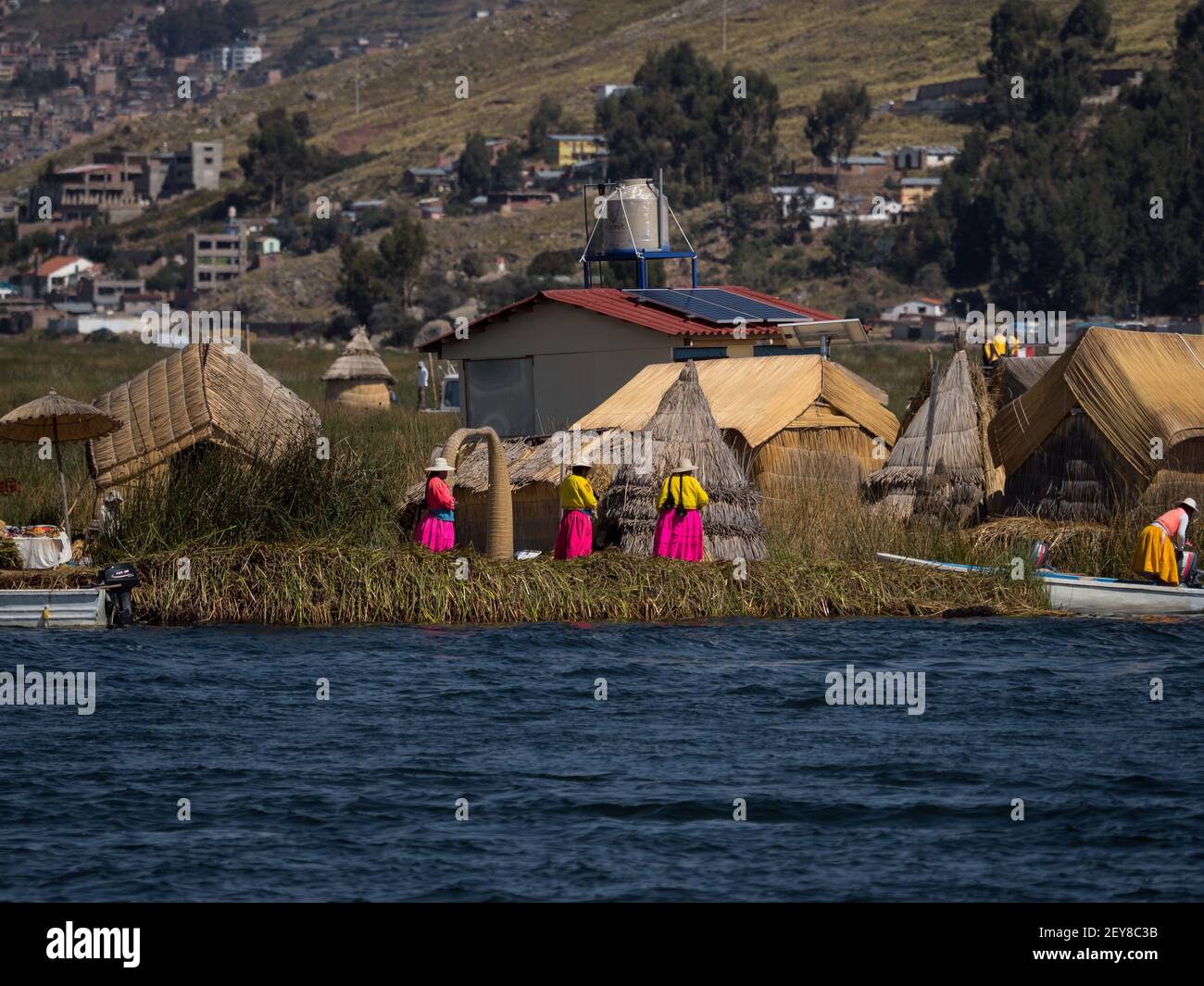 Indigenous women in colorful traditional dresses on Uros Floating reed ...